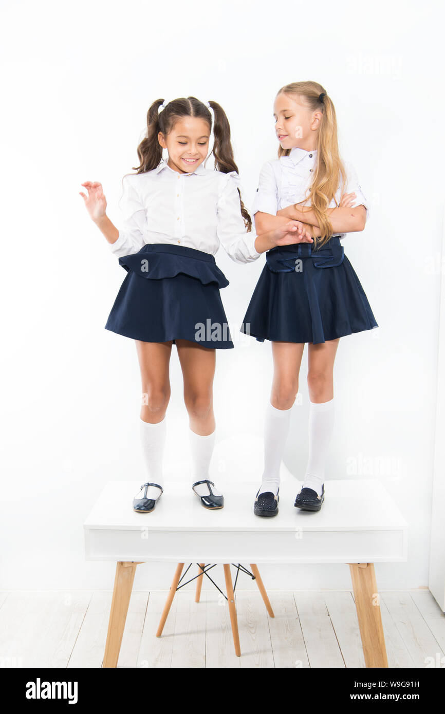 Childhood happiness. School day. Kids cute school students stand on ...
