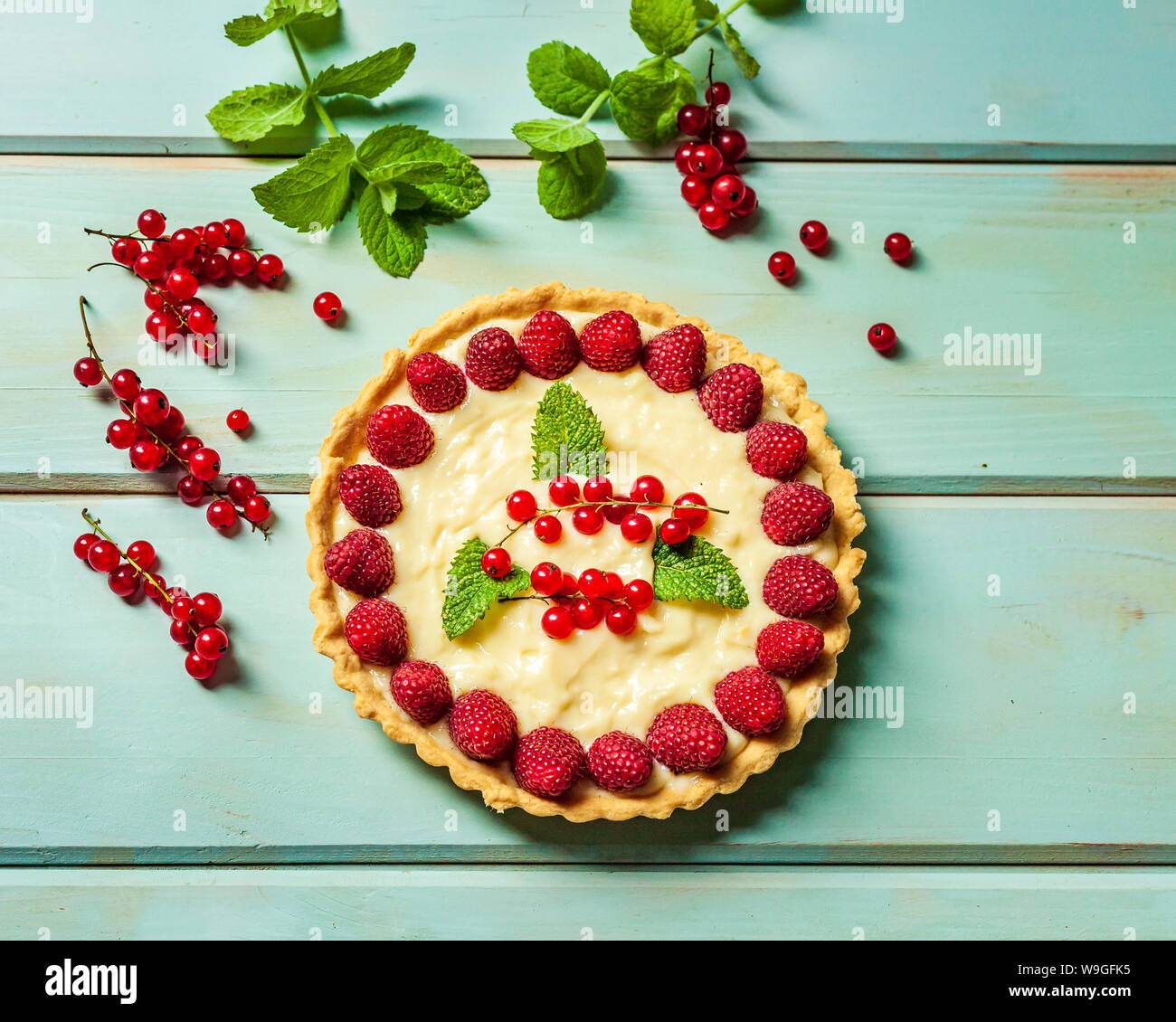 redcurrant pie with fresh berries as summer dessert on wooden ...