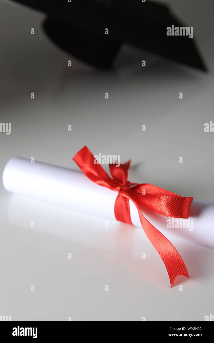 Rolled up graduation diploma scroll hi-res stock photography and images ...