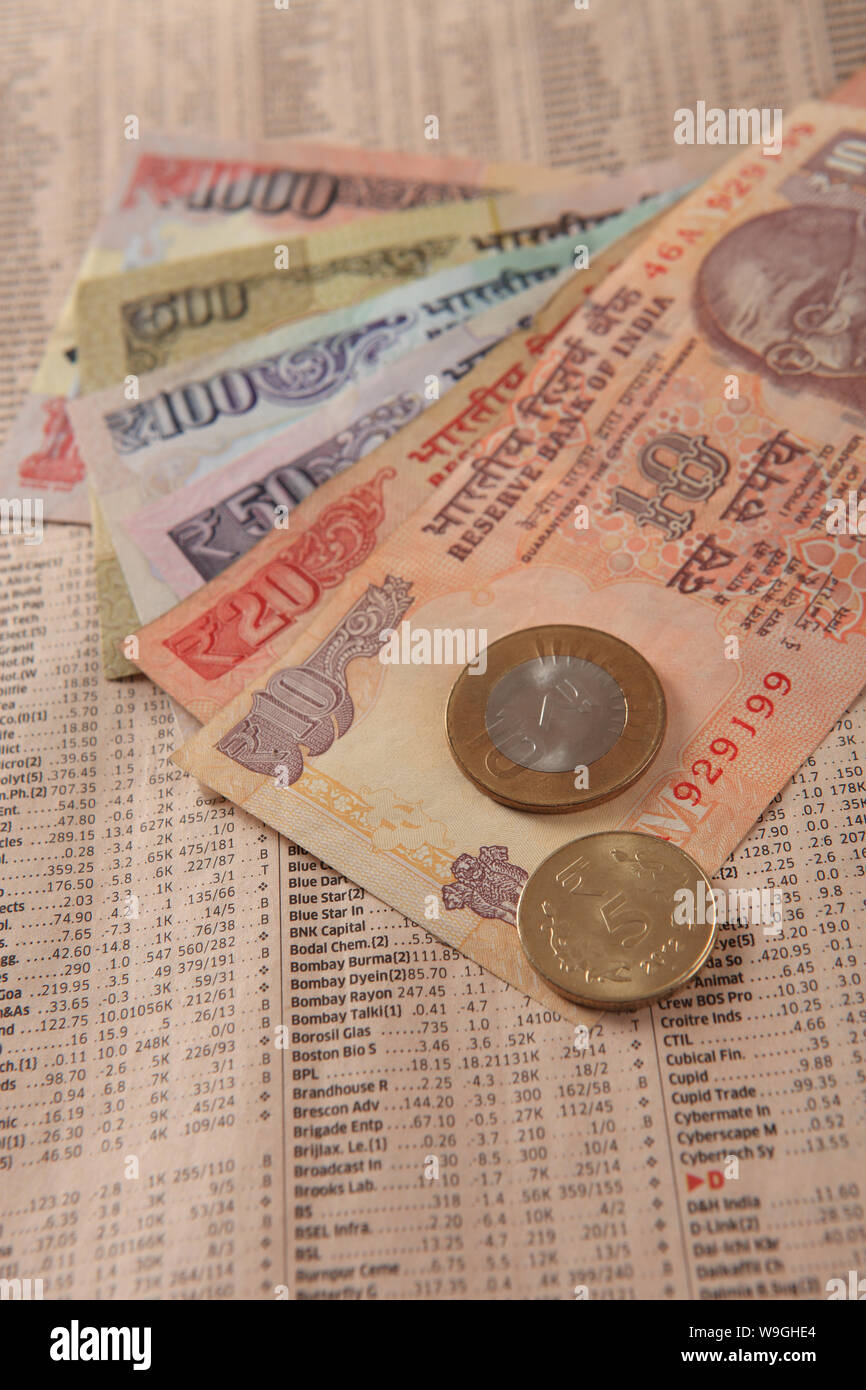 Close up of banknotes with financial newspaper Stock Photo - Alamy