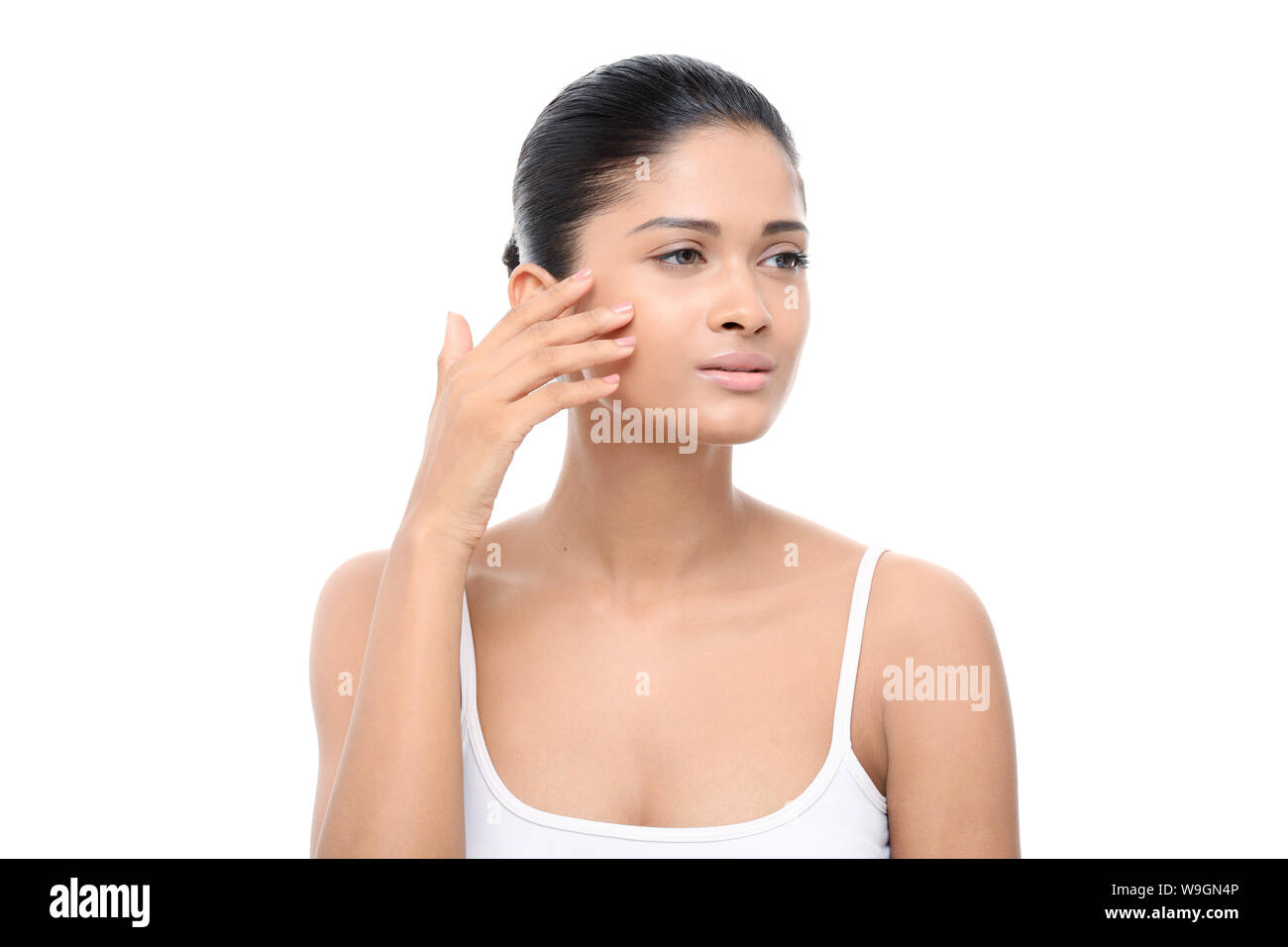 Young woman checking on her face Stock Photo - Alamy