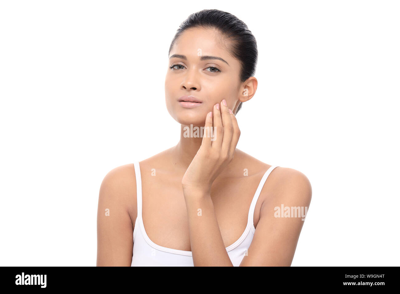 Young woman checking on her face Stock Photo - Alamy