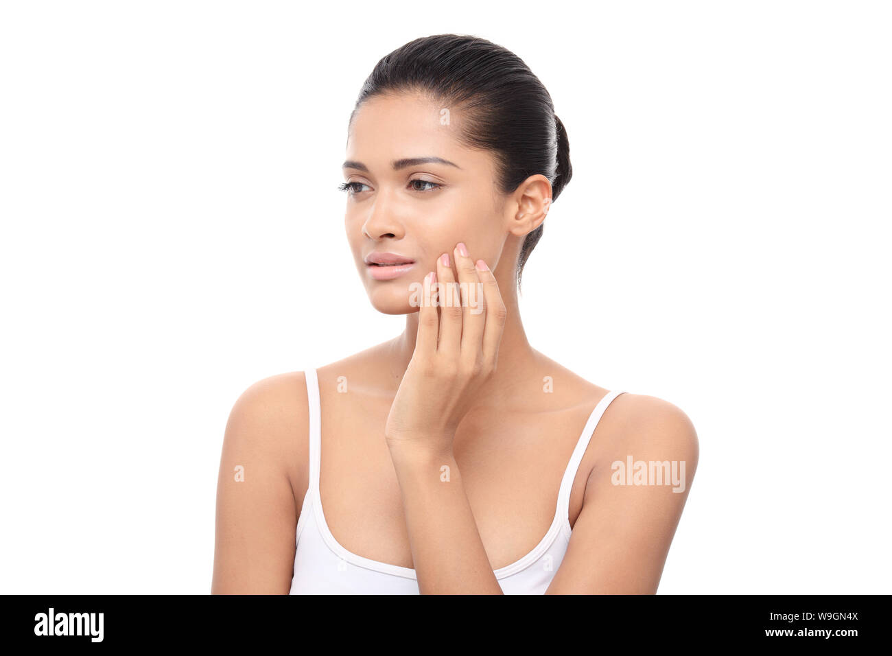 Young woman checking on her face Stock Photo - Alamy