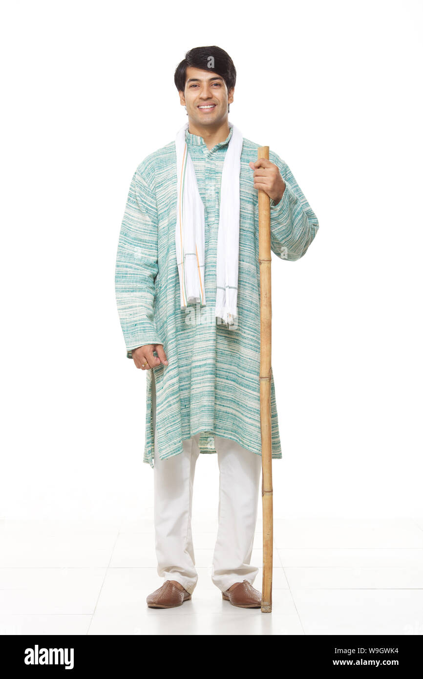 Rural man standing with his cane Stock Photo - Alamy