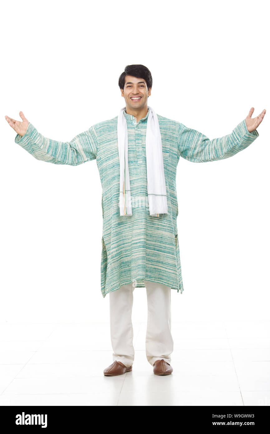 Rural man standing with his arm outstretched Stock Photo - Alamy