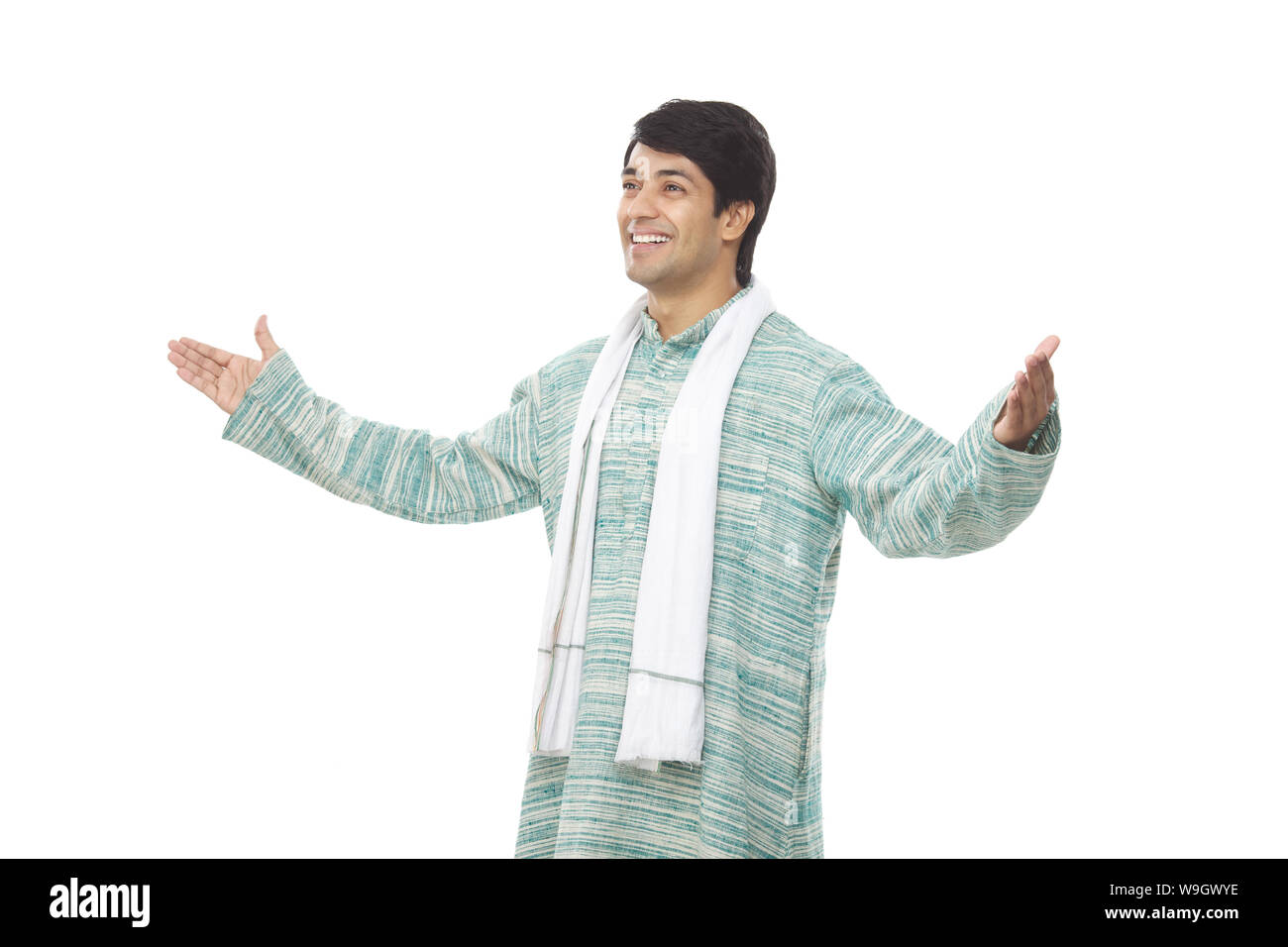 Rural man standing with his arm outstretched Stock Photo - Alamy