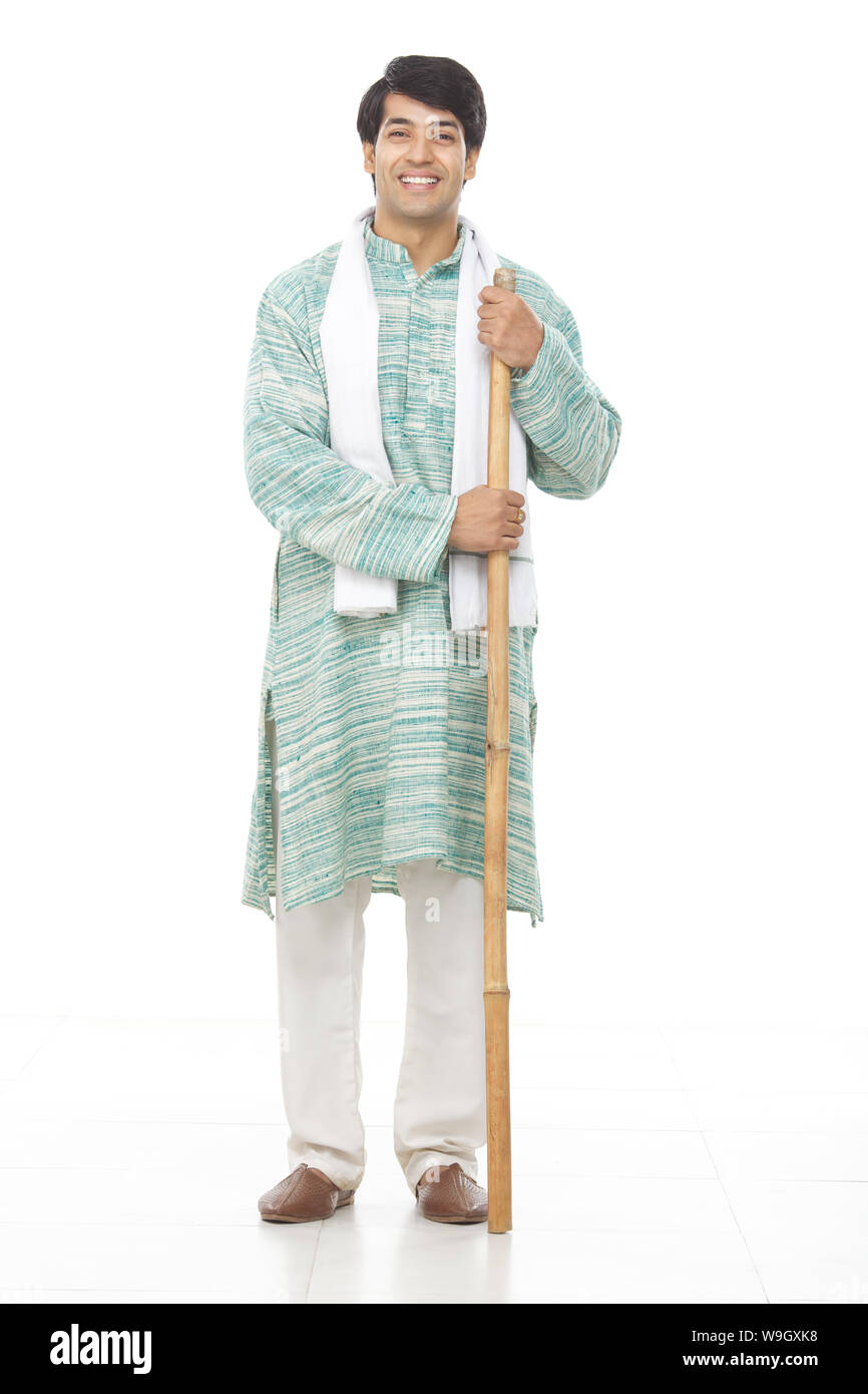 Rural man standing with his cane Stock Photo - Alamy