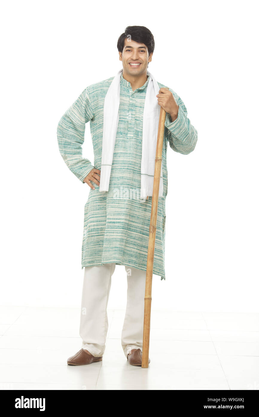 Rural man standing with his cane Stock Photo - Alamy