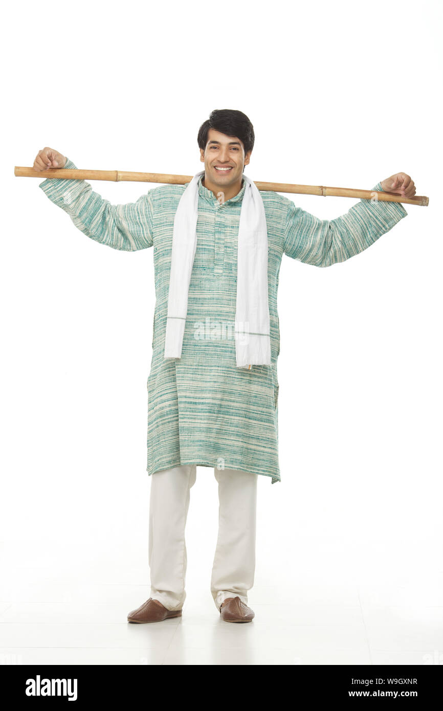 Rural man standing with his cane Stock Photo - Alamy