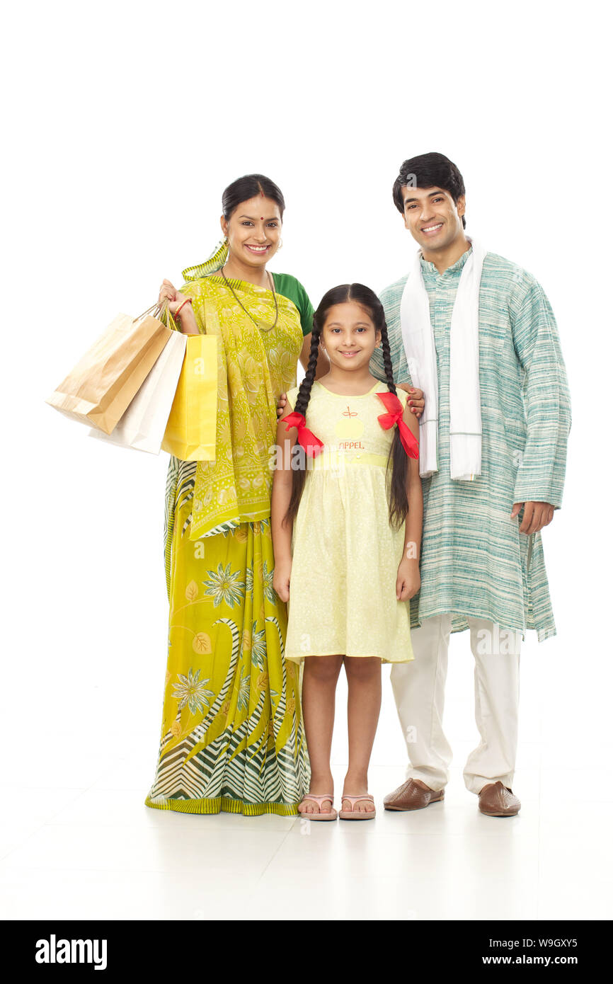 Family carrying shopping bags hi-res stock photography and images - Alamy