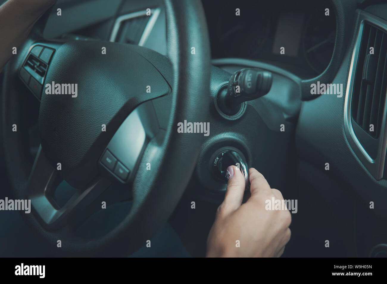 Woman turning ignition key car hi-res stock photography and images - Alamy