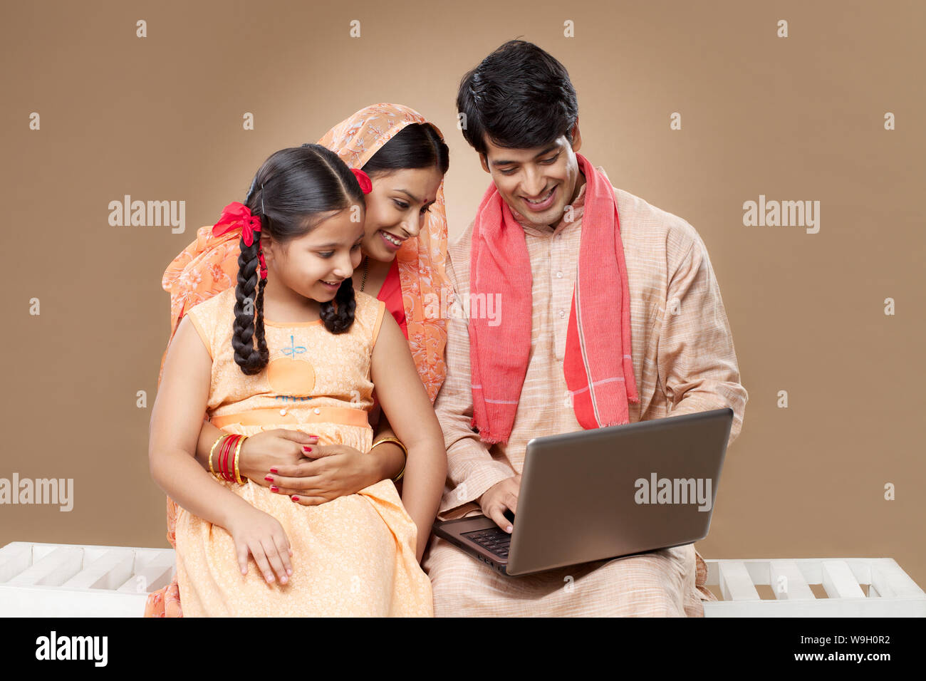 Rural family using laptop Stock Photo - Alamy
