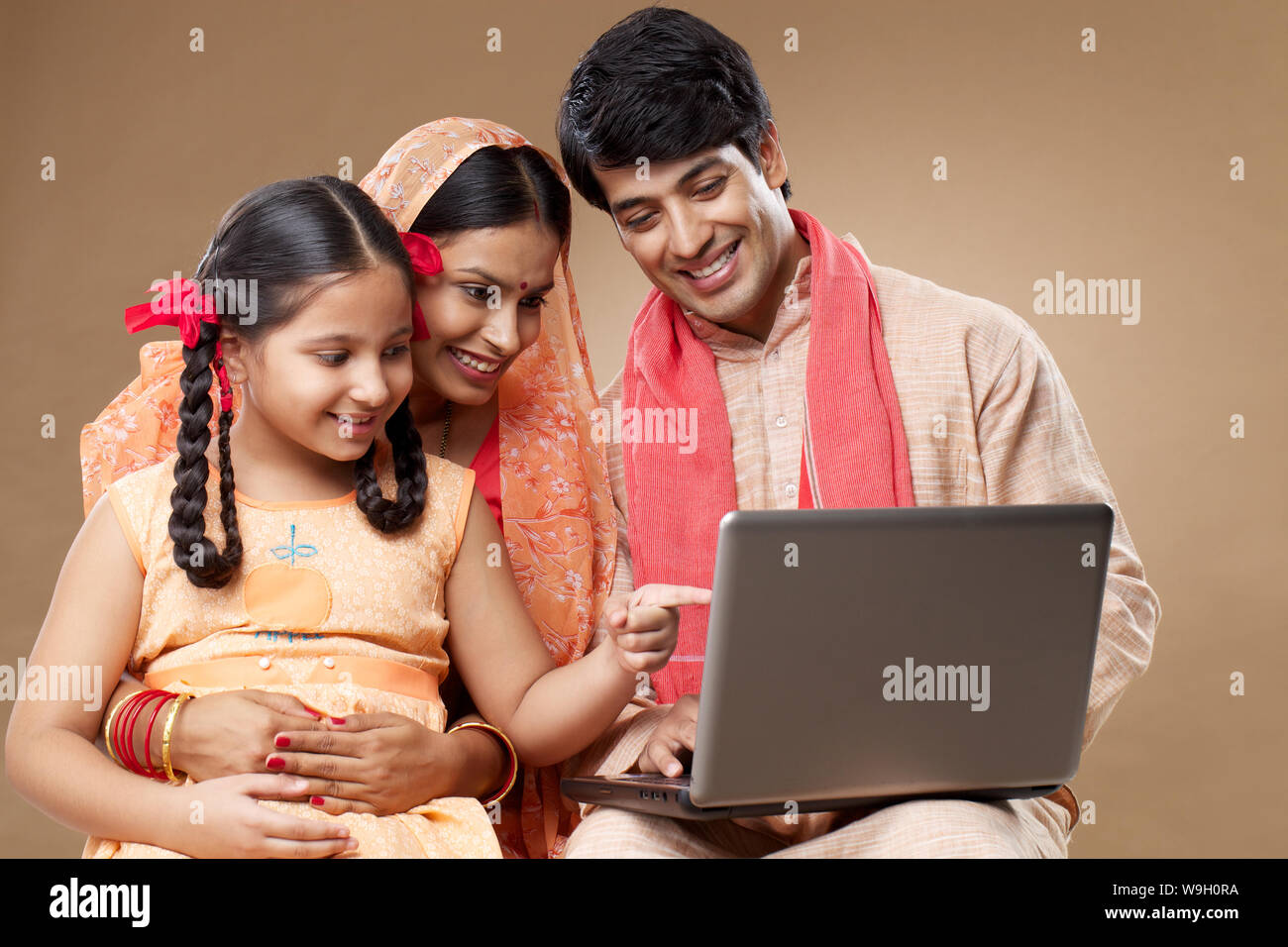 Rural family using laptop Stock Photo - Alamy