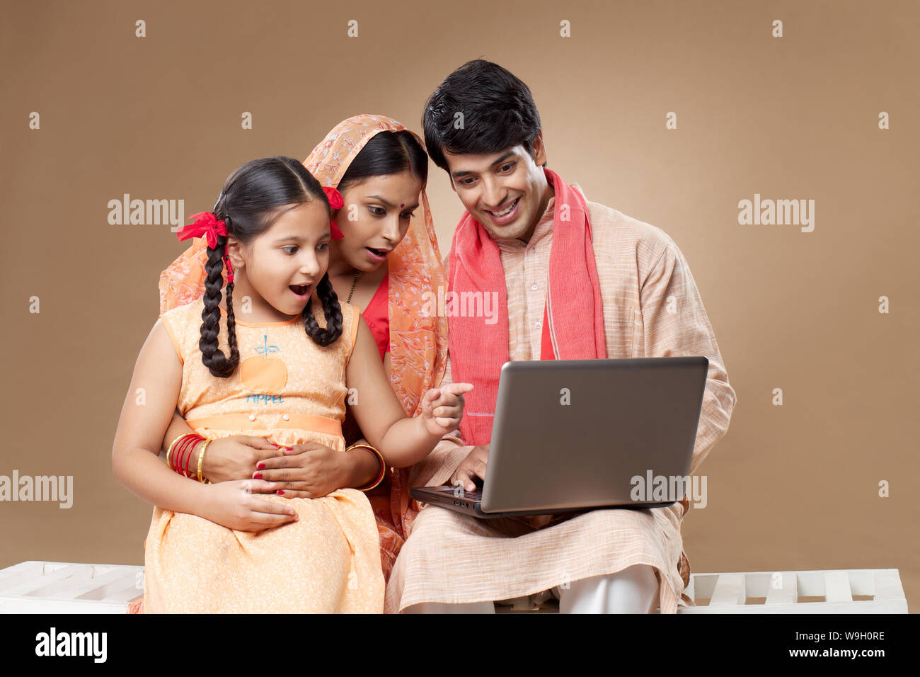 Rural family using laptop Stock Photo - Alamy