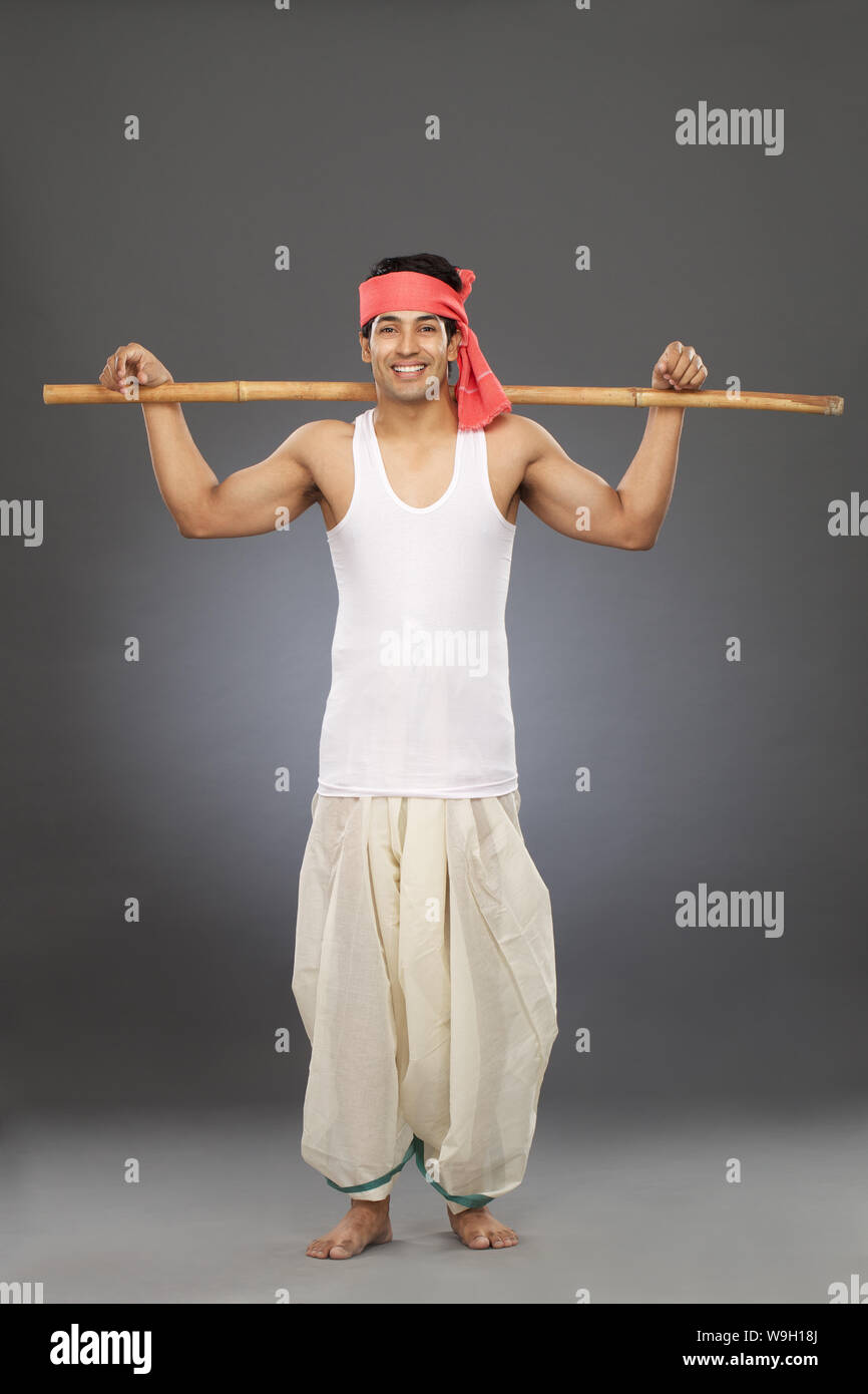Rural man standing with his cane Stock Photo - Alamy