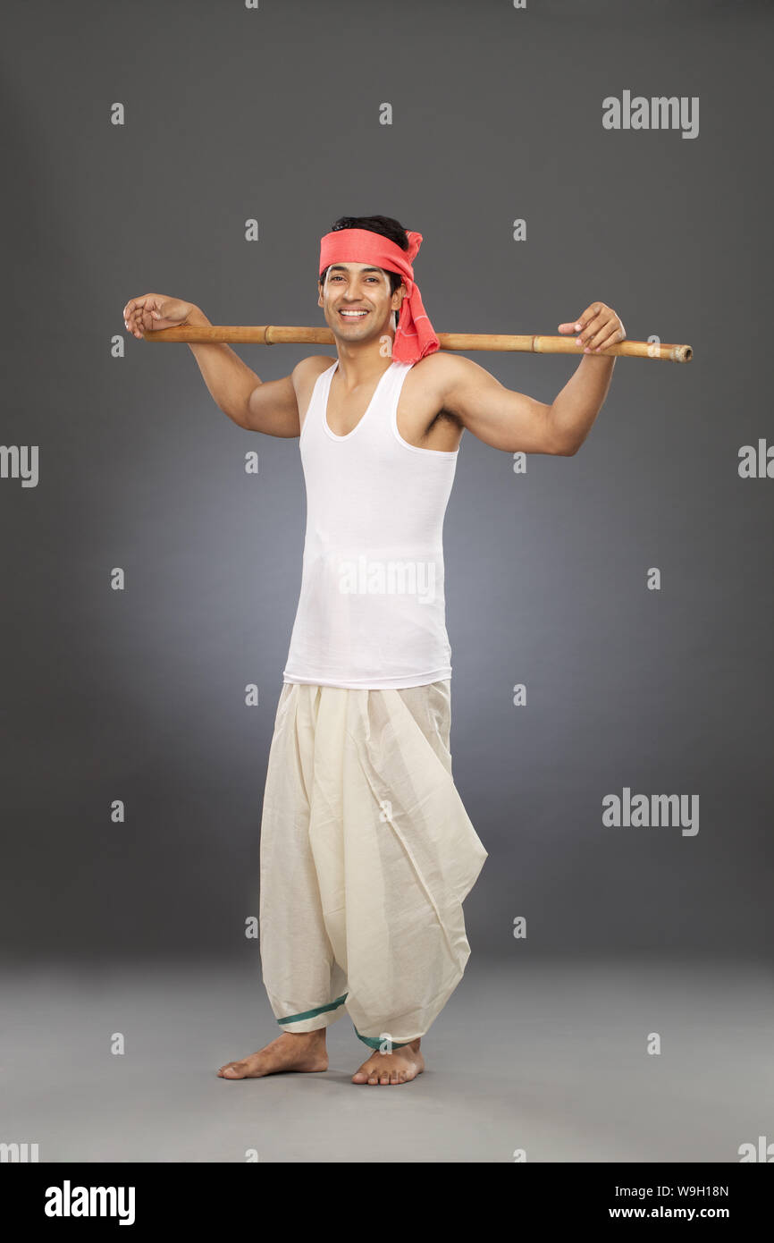 Rural man standing with his cane Stock Photo - Alamy