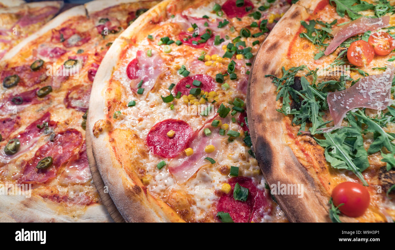 Pizza on a shop window, close-up Stock Photo - Alamy