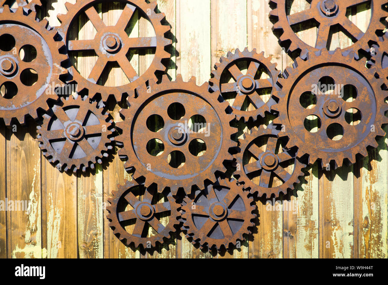 GIANT OLD AND RUSTY COGWHEELS ON THE WALL Stock Photo - Alamy