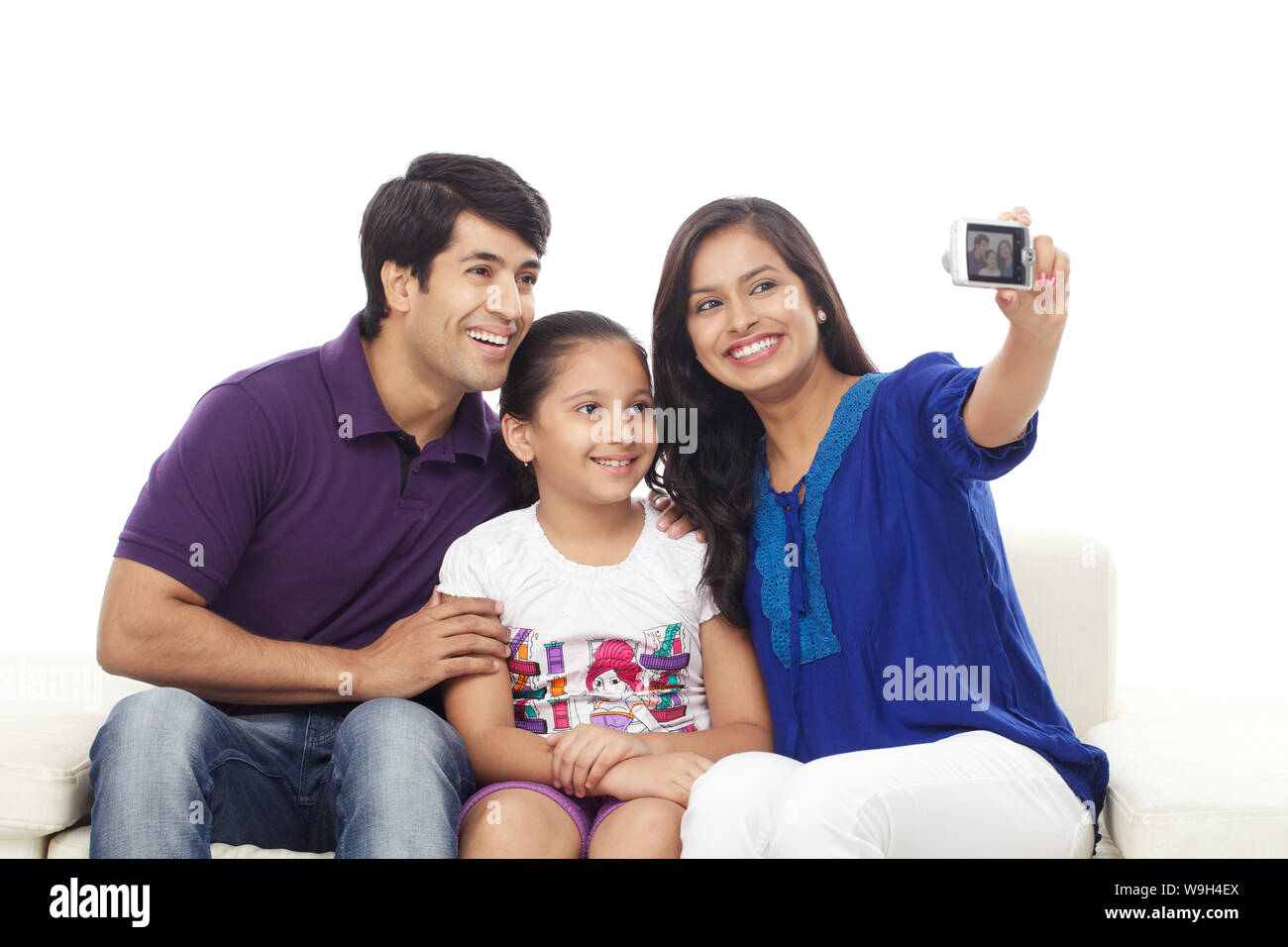 Family taking picture of themselves with a digital camera Stock Photo ...