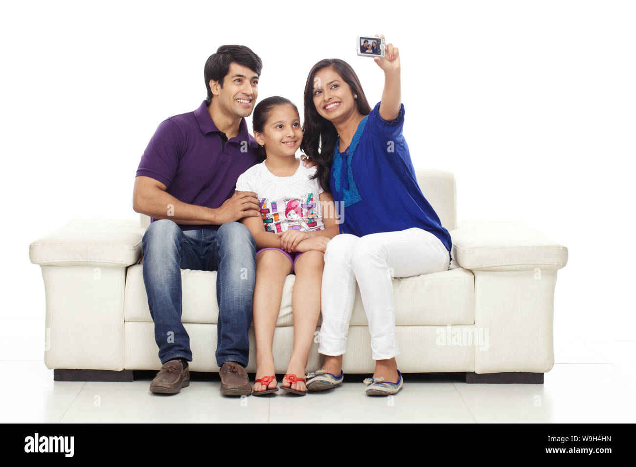 Family looking camera taking picture hi-res stock photography and ...