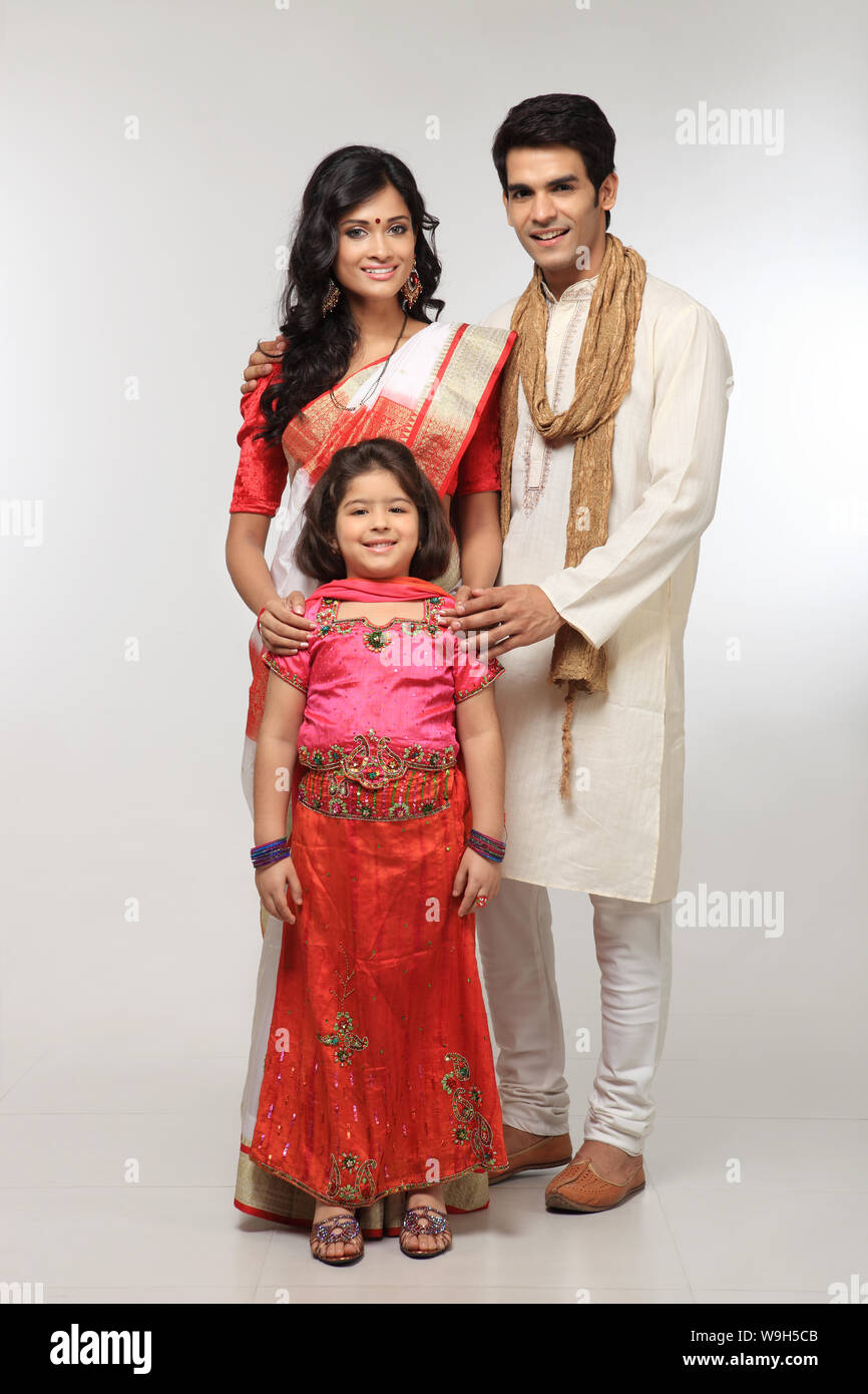 Family standing together and smiling Stock Photo - Alamy