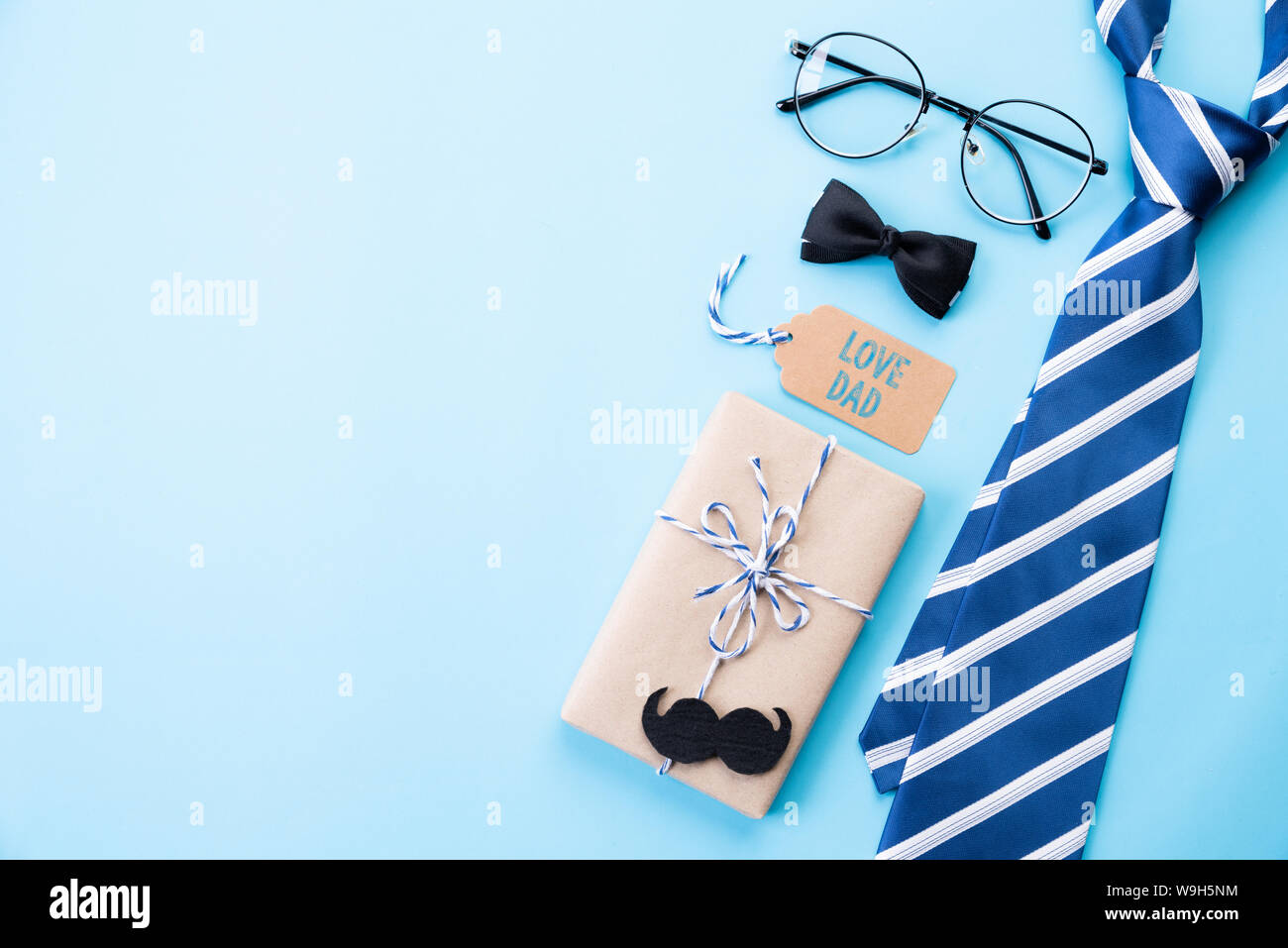 Happy fathers day concept. Top view of blue tie, beautiful gift box ...