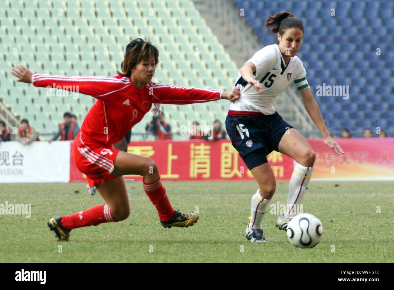 Han Duan of China, in red, fights for the ball with U.S player Kathryn ...