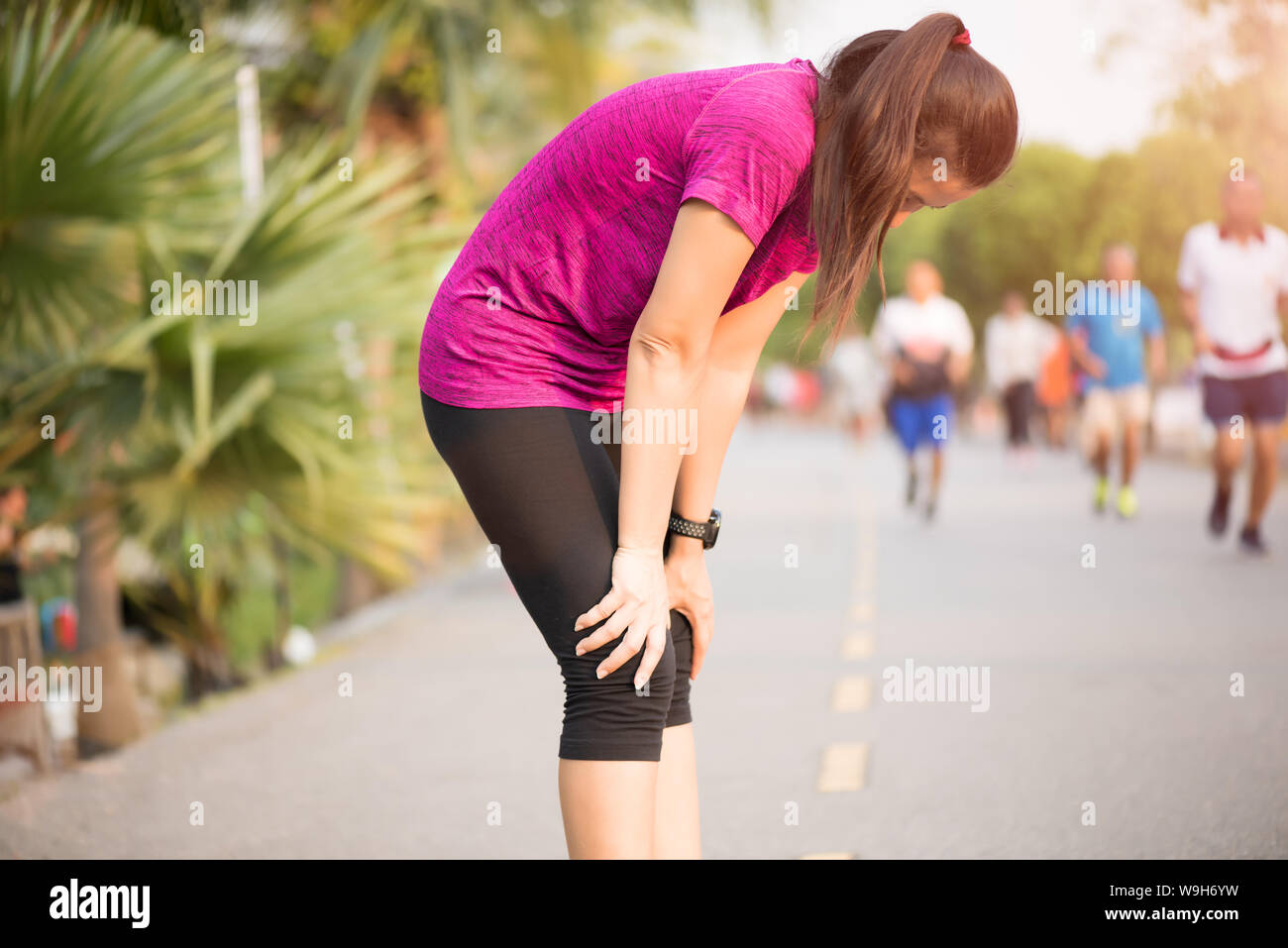 Tired Sport girl after jogging or running work out in park. Sport and ...