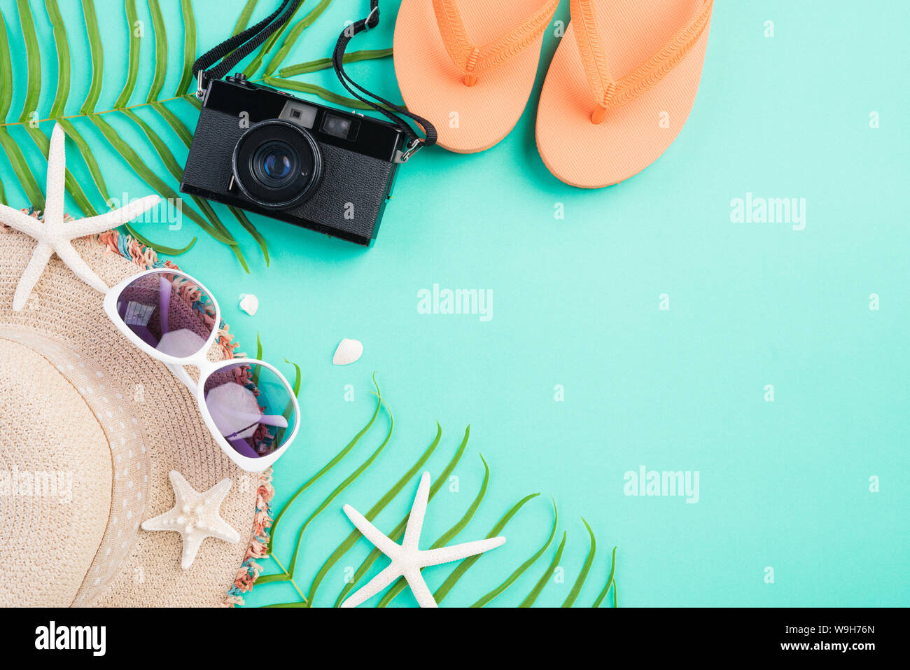 Beach accessories retro film camera, sunglasses, flip flop, starfish ...