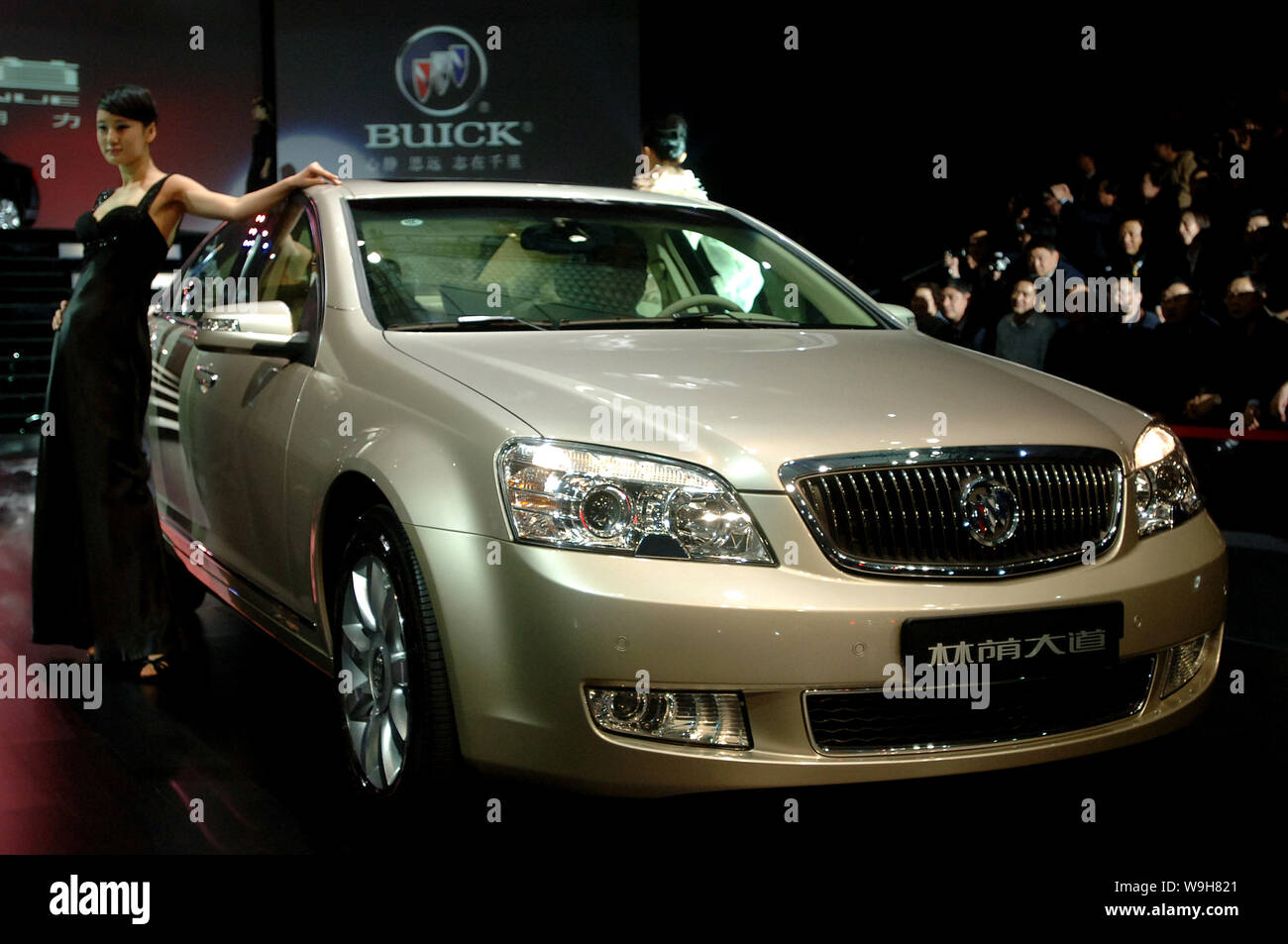 A model poses by a newly unveiled Buick Park Avenue, a top of the line ...