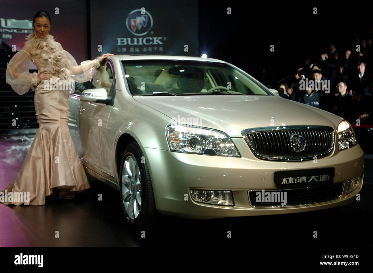 A model poses by a newly unveiled Buick Park Avenue, a top of the line ...