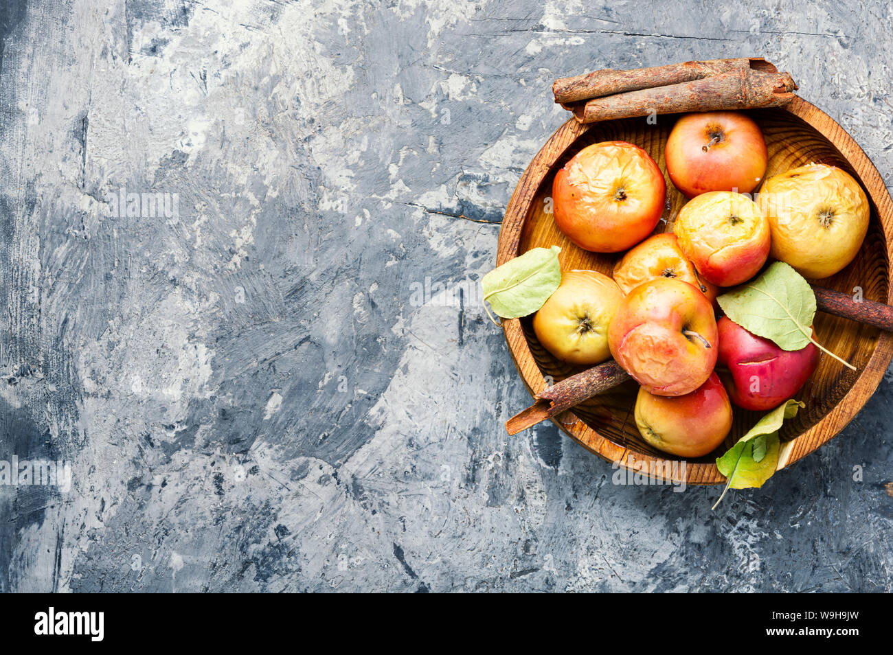 Baked apples with cinnamon and nuts.Fruit dessert baked red apples ...