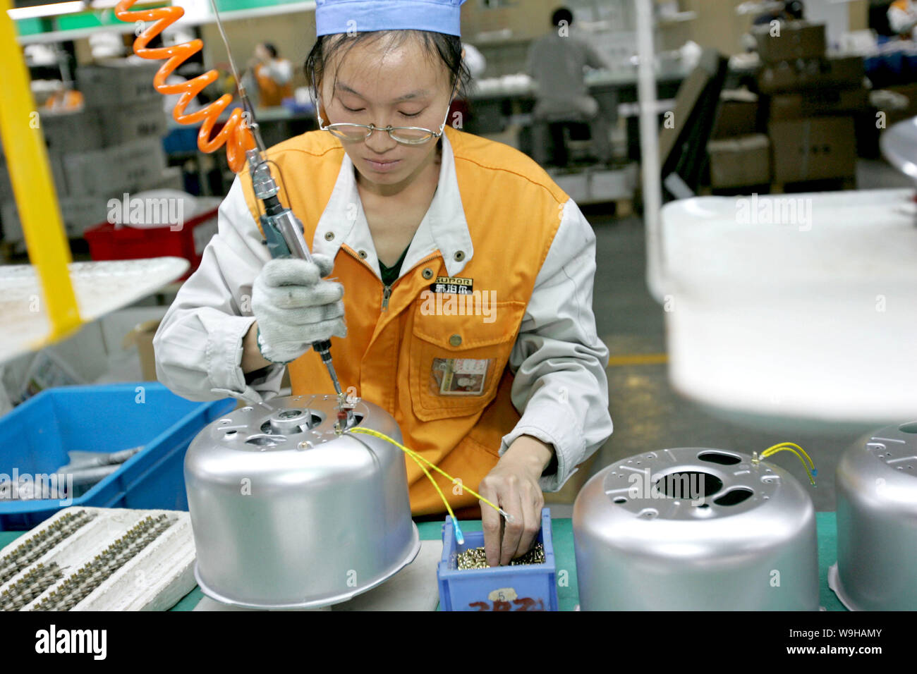 File photo dated 25 October 2005 shows Chinese workers making ...