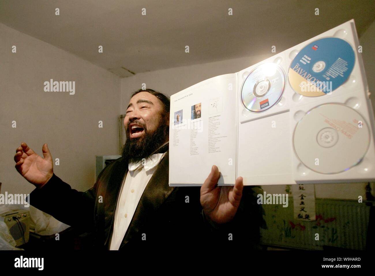 Mr. Jin, 52, dressed like Italian tenor Luciano Pavarotti, sings during ...