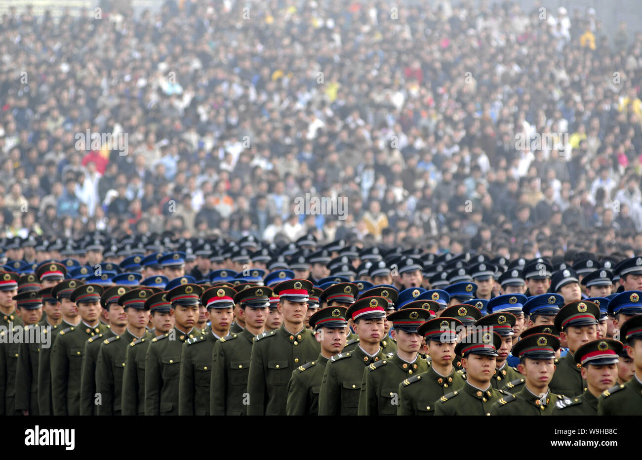 People attend a ceremony marking the 70th anniversary of the Nanjing ...