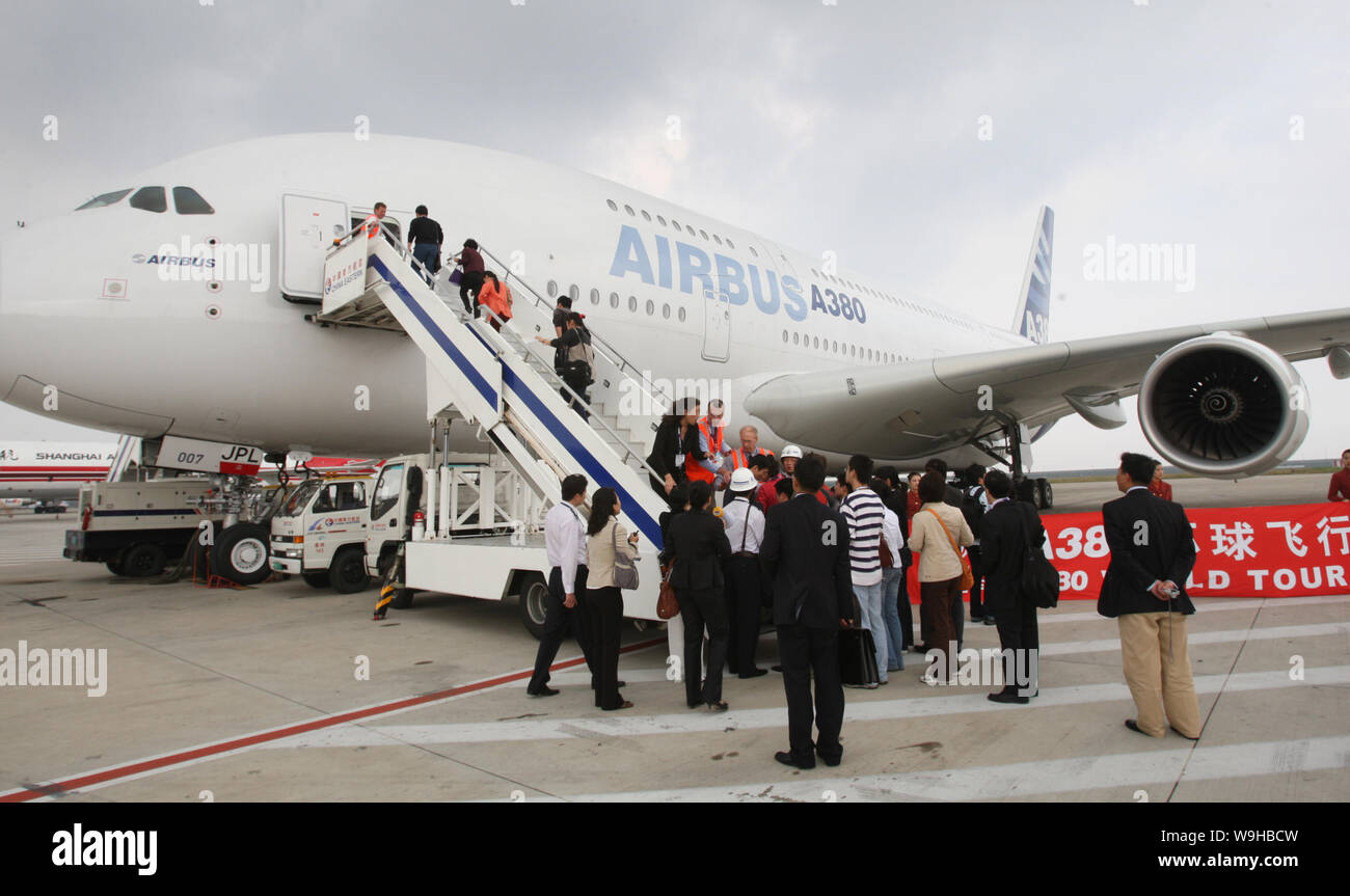 Chinese visitors line up to board an Airbus A380 at Pudong ...