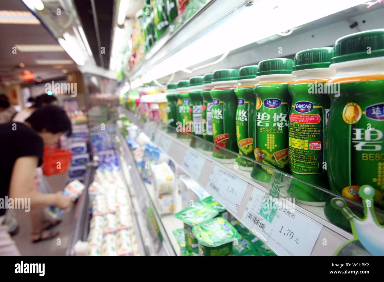 Bottles of Danone yoghurt are seen for sale at a supermarket in ...