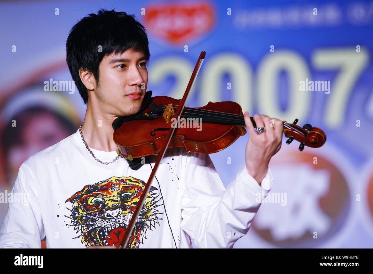Taiwanese star Lee Hom Wong plays violin during a gathering with his ...