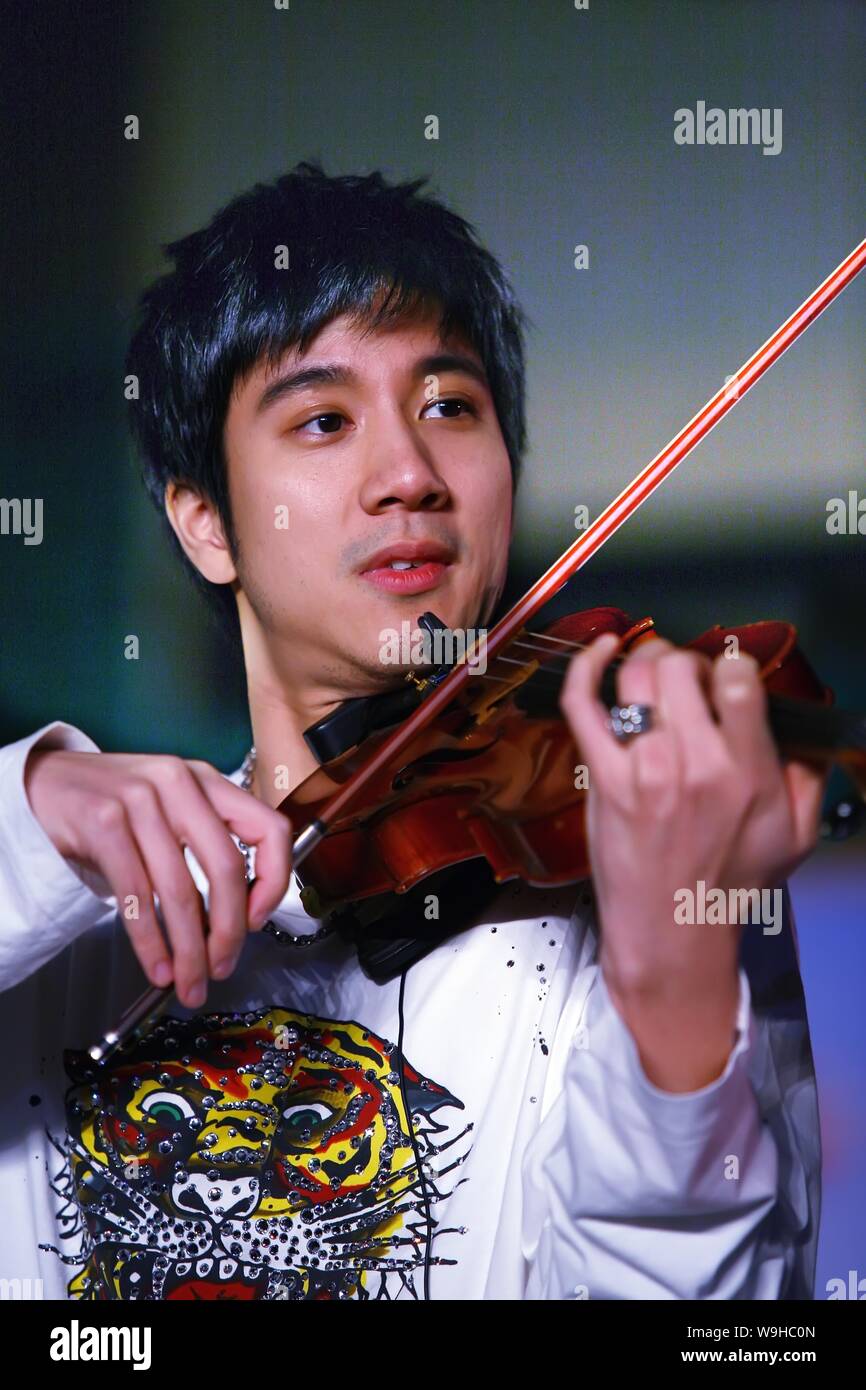 Taiwanese star Lee Hom Wong plays violin during a gathering with his ...