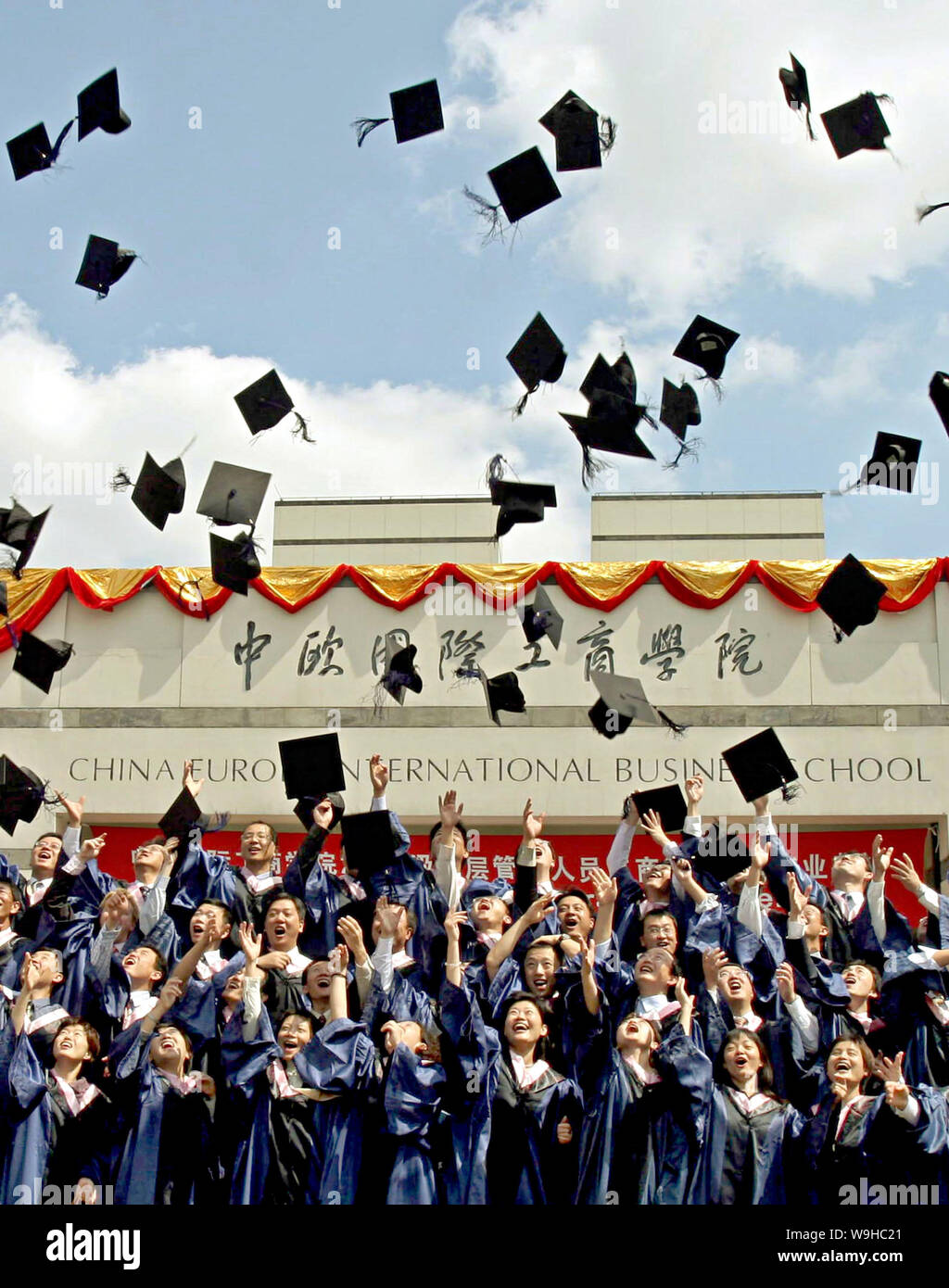EMBA program graduates celebrate at the graduation ceremony in China ...
