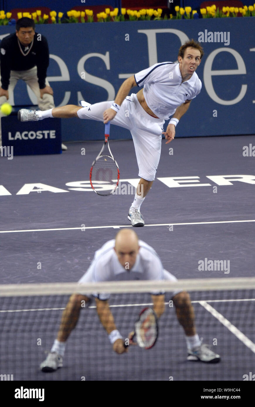 Paul Hanley of Australia, background, and Kevin Ullyett of Zimbabwe ...