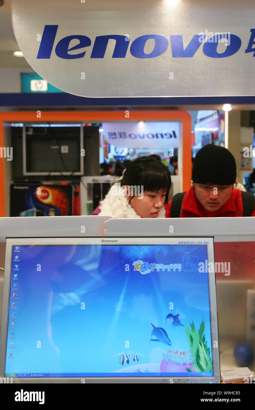 Chinese customers shop for Lenovo laptop computers at a shopping mall ...