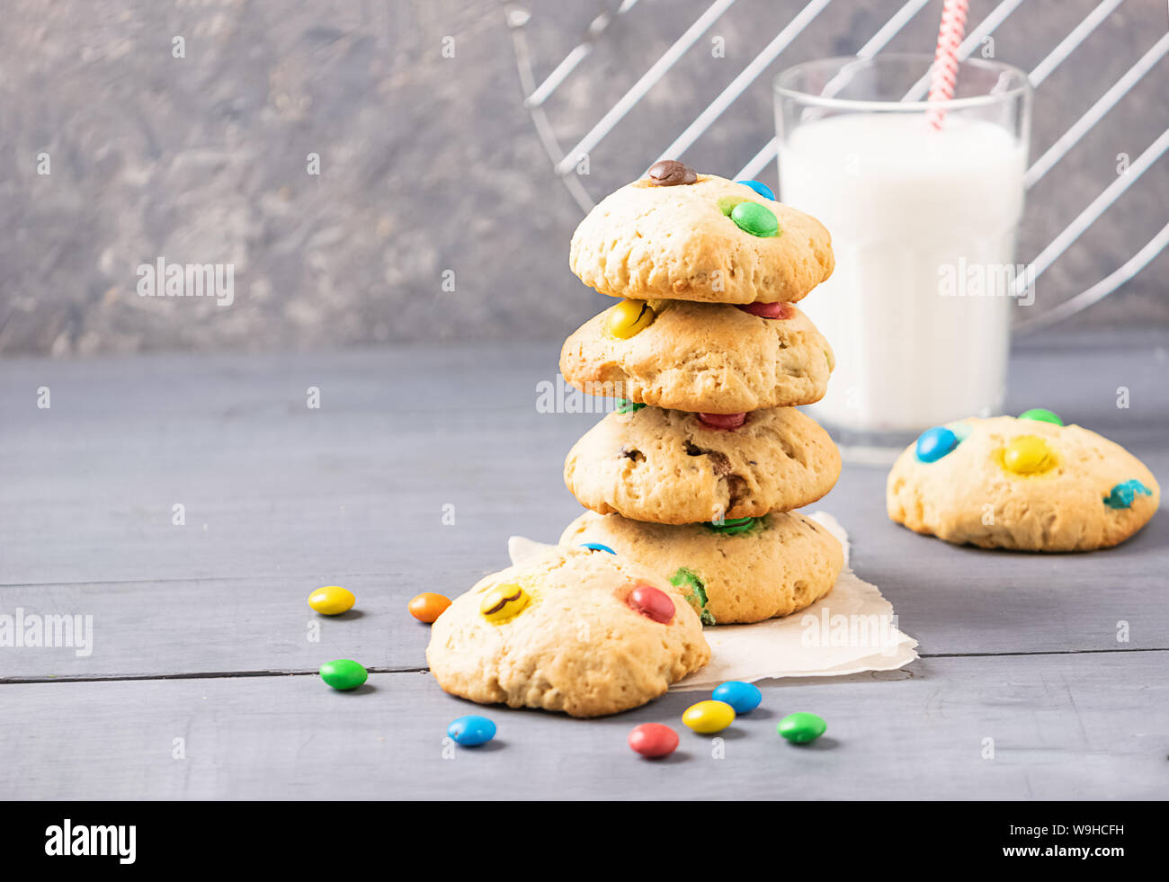 Homemade cookies decorated with multi-colored sweets dragees in a stack ...