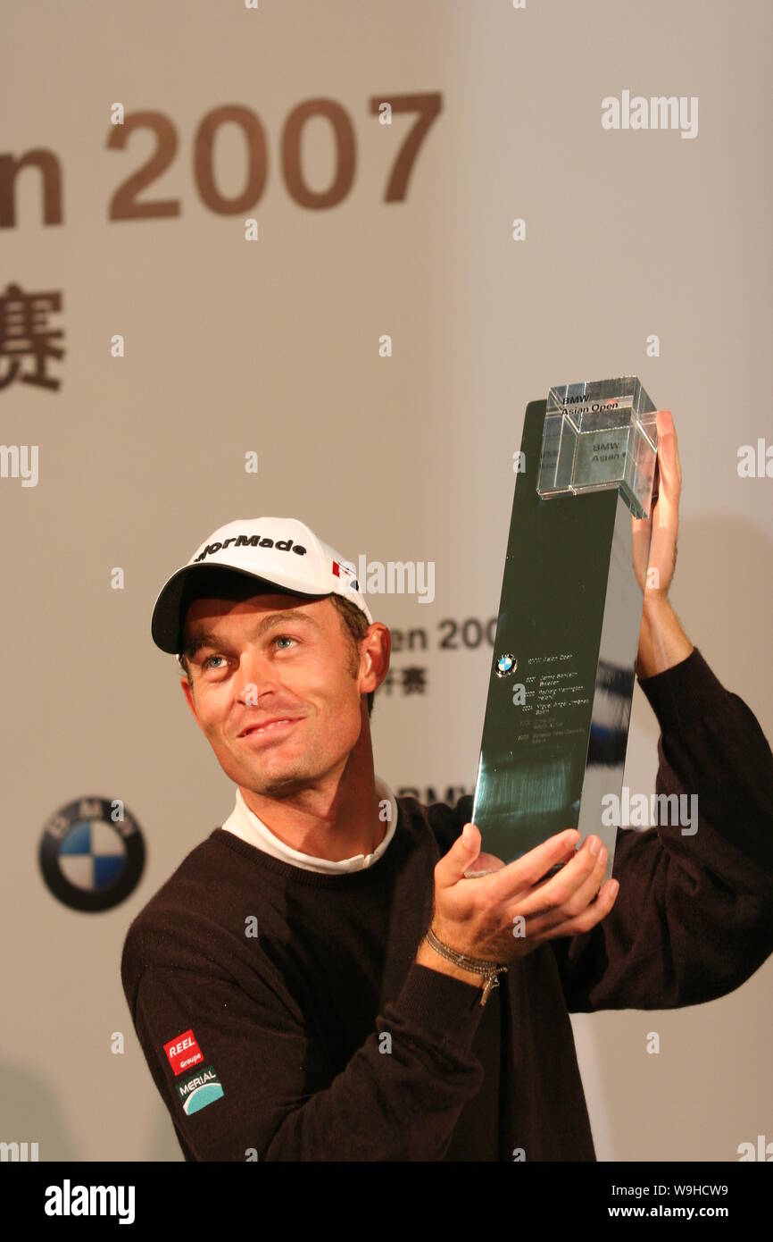 Raphael Jacquelin of France shows his trophy during the awards ceremony ...