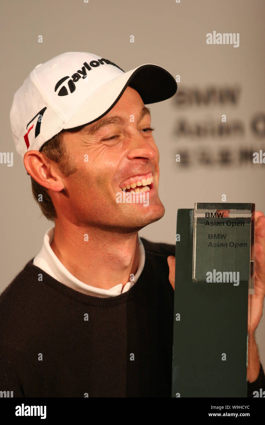 Raphael Jacquelin of France shows his trophy during the awards ceremony ...