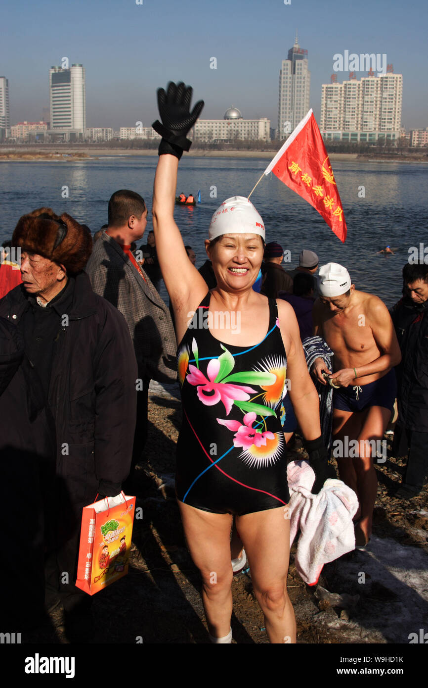 Chinese wintertime swimming participants swimming in chilly water ...