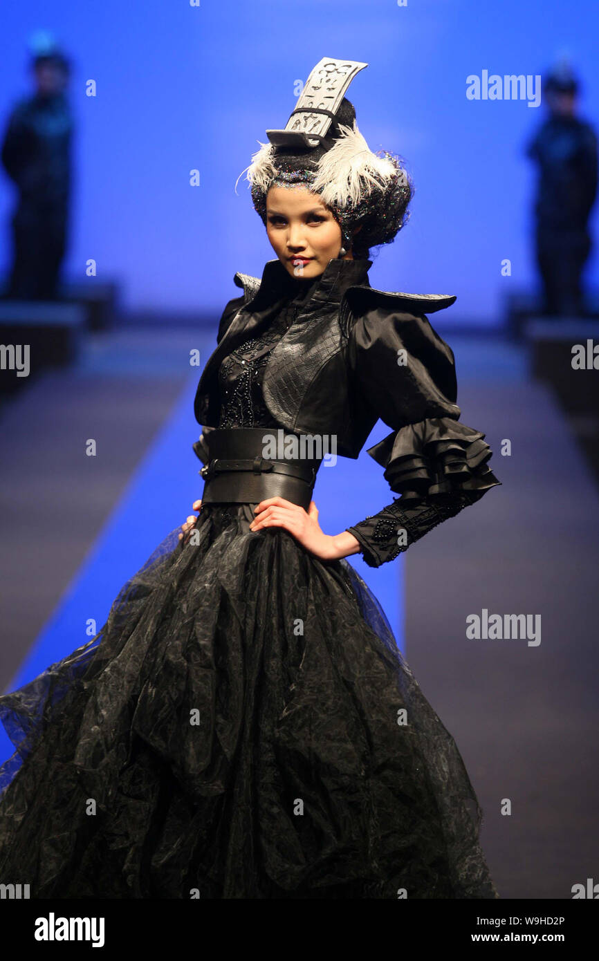 Chinese model Mo Wandan parades a fashion design by Chinese designer Ji ...
