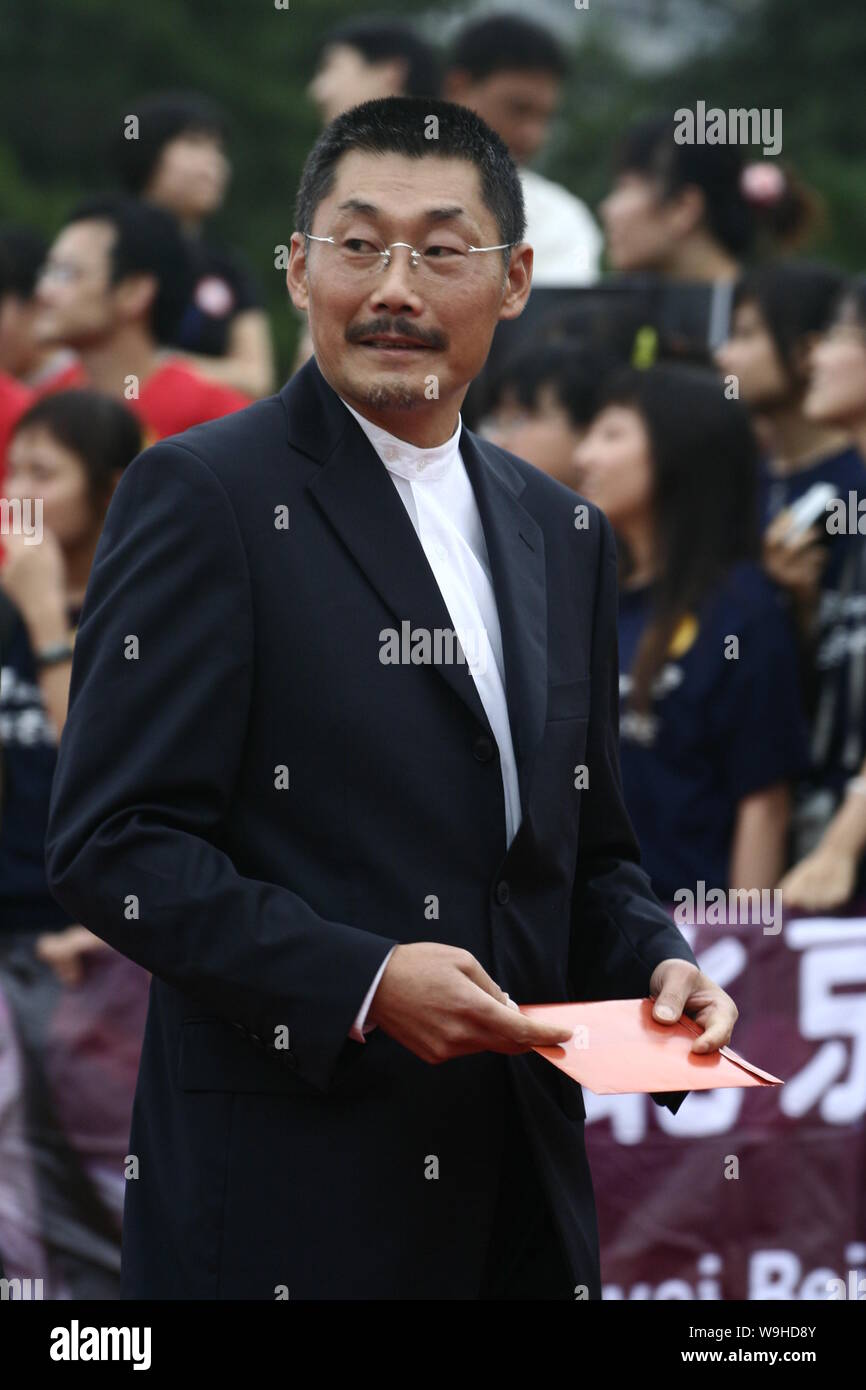 Chinese director He Ping poses on the red carpet at the 12th annual Hua ...