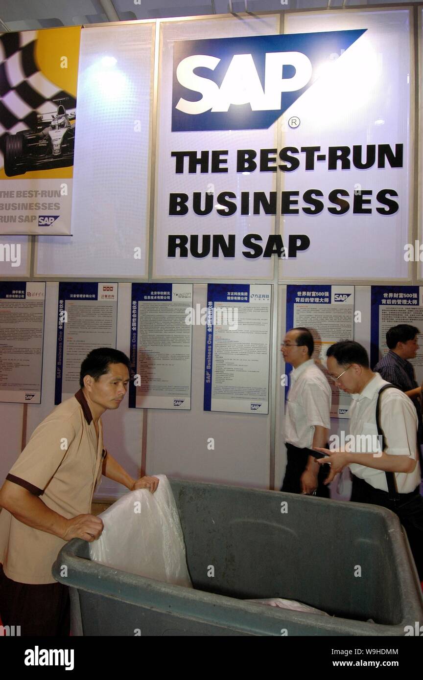 Visitors at the stand of SAP during an exhibition in Beijing 2004 Stock ...