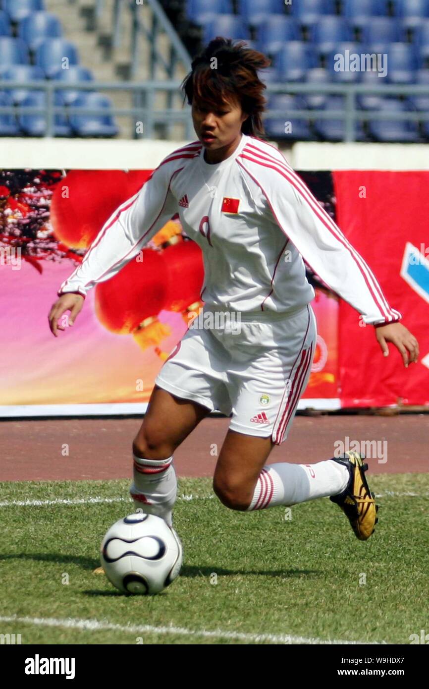 Chinas Han Duan,in white,battles for the ball during her Four Nations ...
